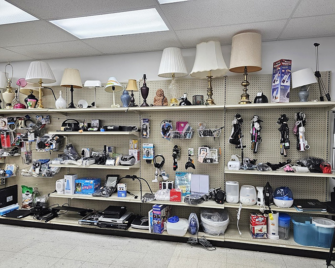 The home electronics section—a technological time capsule where vintage lamps, clock radios, and that perfect retro blender await their comeback tour.