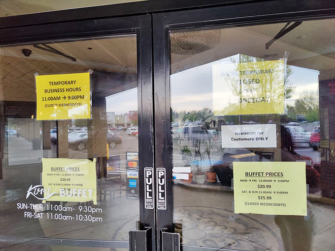 Business hours posted like sacred text. The information every buffet pilgrim needs before embarking on their gastronomic journey.