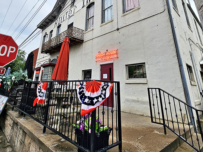 Patriotic bunting frames the entrance, welcoming visitors to a slice of Americana where food traditions are preserved one plate at a time.