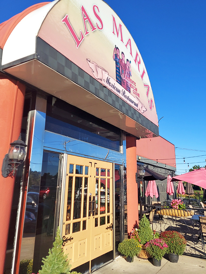 Golden doors framed by the restaurant's signature arch &ndash; the gateway to your next favorite Mexican meal in Greenville.