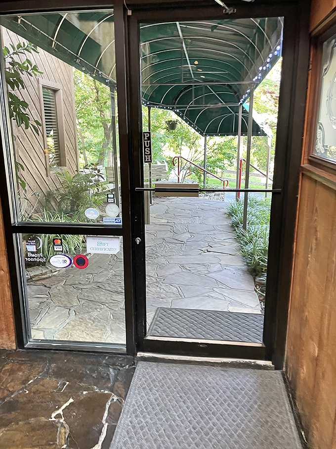 The view from inside looking out&mdash;where the line between restaurant and nature blurs. That green canopy promises shelter for your post-meal waddle.