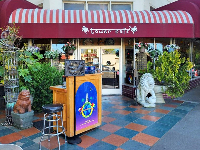 The welcoming entrance with its distinctive red awning and colorful planters signals you've arrived somewhere special&mdash;a Sacramento institution worth the wait.