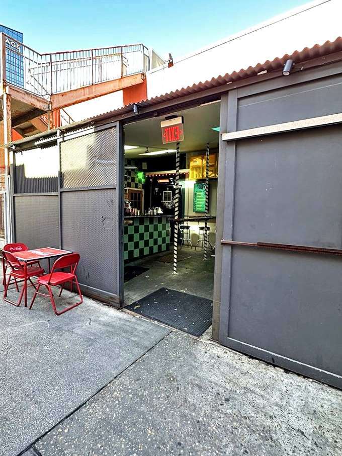 The entrance at dusk&mdash;an unassuming doorway that separates the uninitiated from those who know where Austin's taco magic really happens.