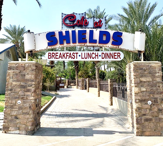 The entrance sign beckons like a desert mirage, except this oasis delivers on its promises of breakfast, lunch, dinner, and date-fueled bliss.