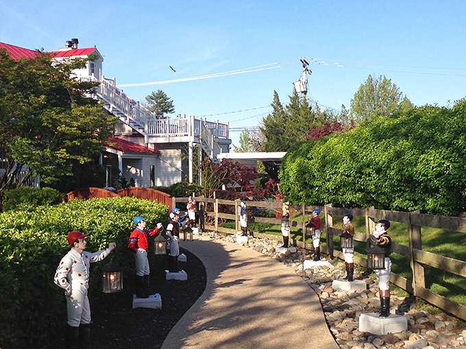 The approach to culinary nirvana is lined with jockey statues—a charming reminder that you're in horse country, where both steeds and steaks are taken seriously.