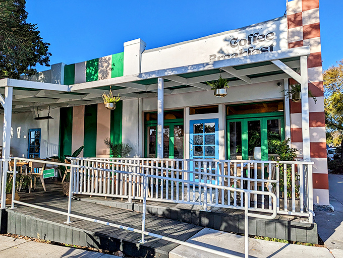 The exterior view showcases Madi's welcoming porch—where the only thing better than the people-watching is knowing breakfast awaits just beyond those green doors.