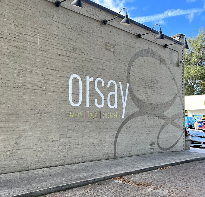 The daytime view of Orsay's exterior wall reveals its understated elegance&mdash;wine, food, cocktails&mdash;three simple words that promise so much more inside.