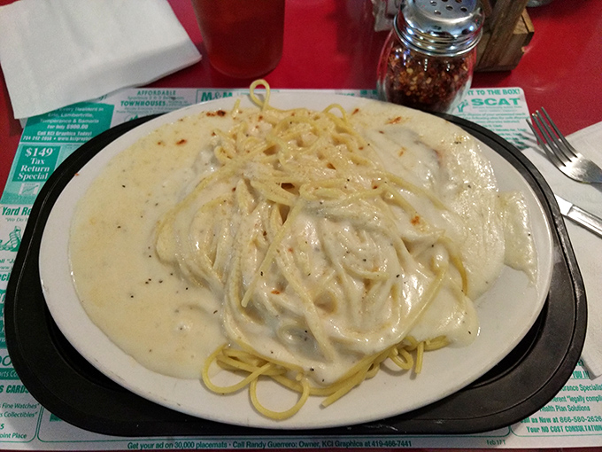 Fettuccine Alfredo so creamy it should come with a warning: "May induce immediate food coma and declarations of undying loyalty."