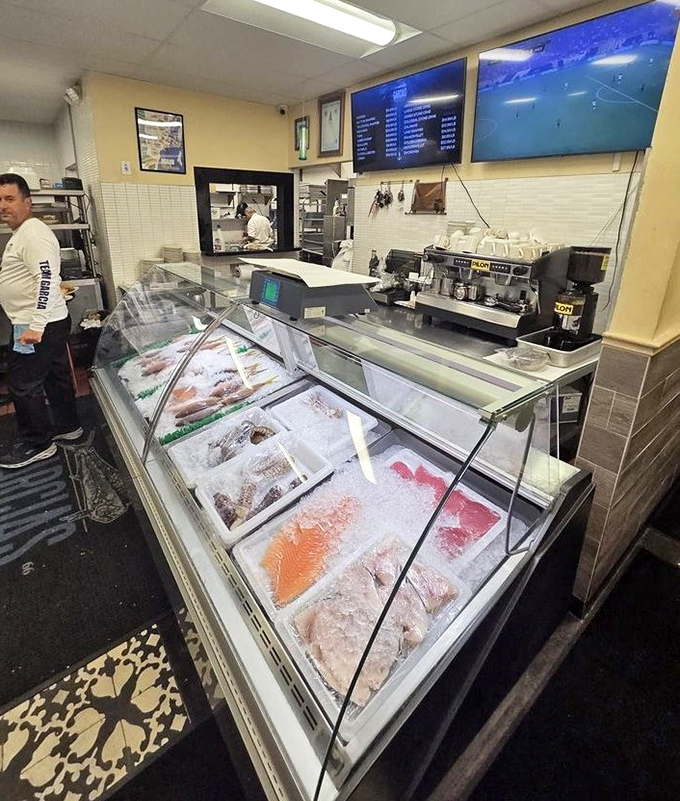 The fish market display case&mdash;where tomorrow's menu items rest on ice, eyes clear and gills bright, the ultimate freshness guarantee.