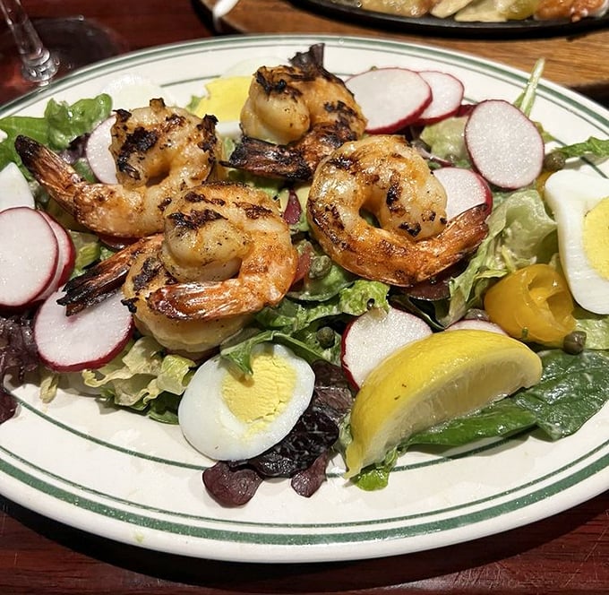 A salad that makes you forget you're eating healthy. Grilled shrimp and hard-boiled eggs make this the opposite of sad desk lunch.