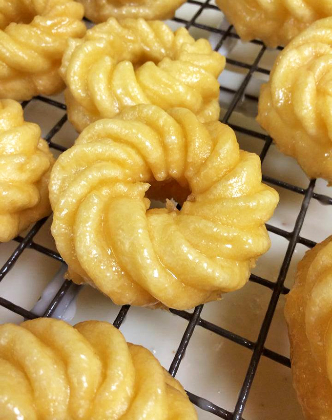 French crullers that defy physics&mdash;impossibly light yet substantial, with ridges that capture just the right amount of glaze in every delicate bite.