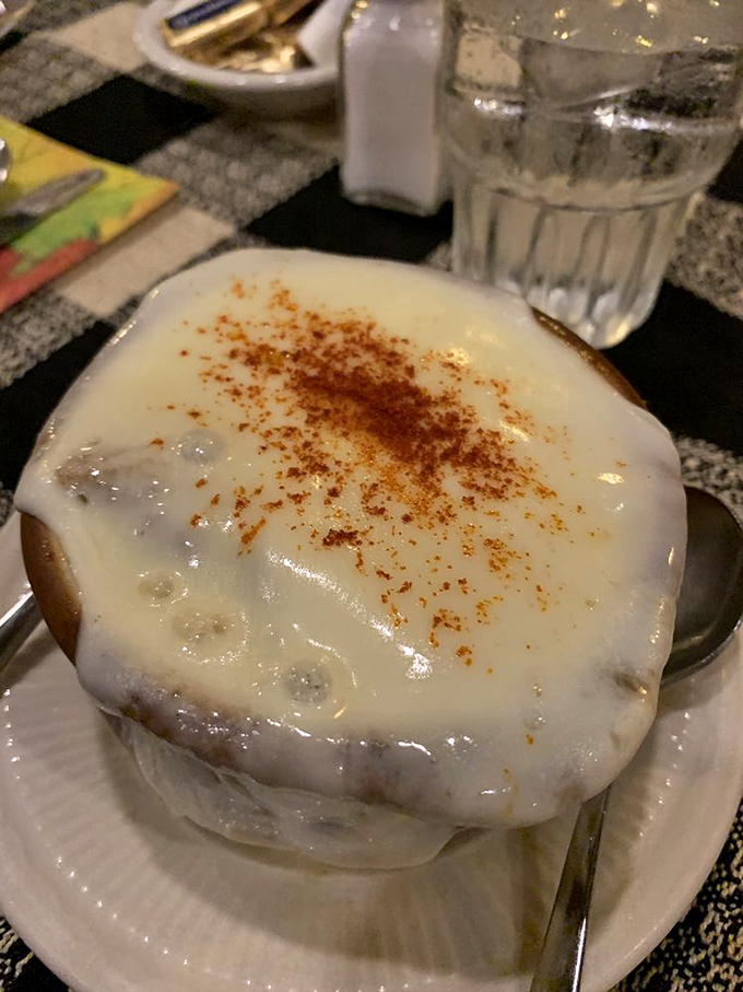 French onion soup wearing its cheese cap like a crown. This bubbling masterpiece demands a moment of silent appreciation before diving in.