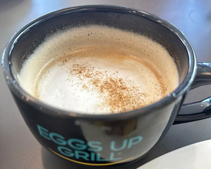 A coffee mug that knows its purpose in life. That gentle dusting of cinnamon is like the final brushstroke on breakfast's Mona Lisa.