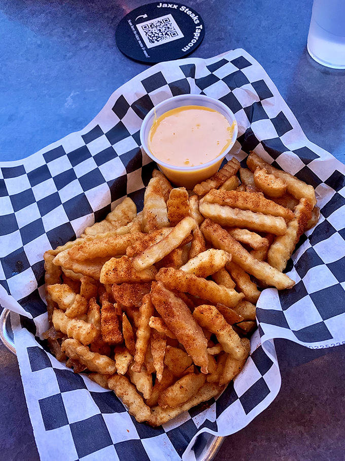 Crinkle-cut fries with cheese sauce&mdash;the supporting actor that sometimes steals the show from the sandwich headliners.