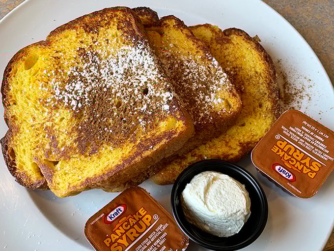French toast that's achieved the golden-brown perfection we all attempt at home but rarely achieve. The breakfast equivalent of winning the lottery.