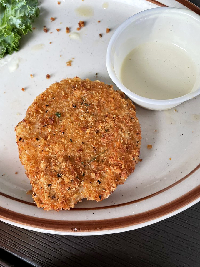 Not your grandmother's fried green tomato (unless your grandmother was a culinary genius). Crispy, tangy perfection with a side of creamy dipping sauce.