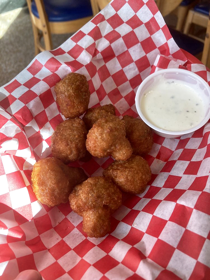 Golden-fried mushrooms that crunch like nature's perfect snack, with ranch dipping sauce that makes vegetables feel like an indulgence.