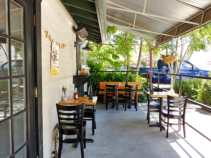 The covered patio offers that perfect middle ground between indoors and outdoors &ndash; protection from elements while still feeling connected to nature.