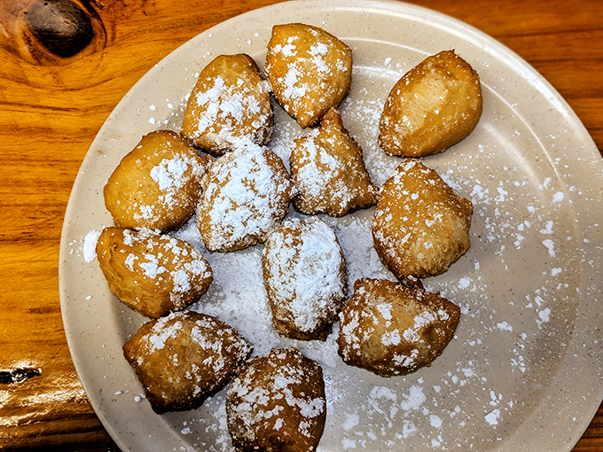 Funnel cake balls dusted with powdered sugar&mdash;proof that sometimes the best innovations are just beloved classics in a more poppable form.