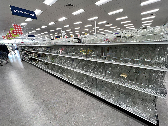 The glassware aisle stretches into infinity, a crystal cave of drinking vessels where your perfect set of mid-century tumblers hides in plain sight.