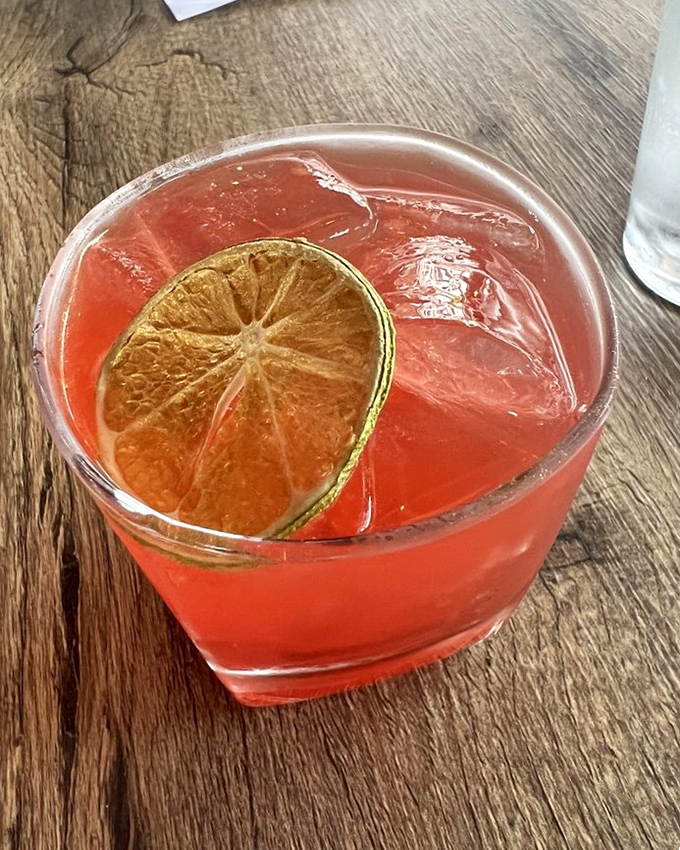 A cocktail that glows like a sunset, with that perfect lime wheel perched on the edge &ndash; one sip and you're transported somewhere tropical.