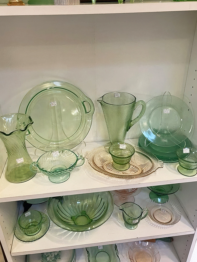 Depression glass in delicate green hues captures the light like liquid emeralds&mdash;kitchen treasures from grandmother's era that never go out of style.