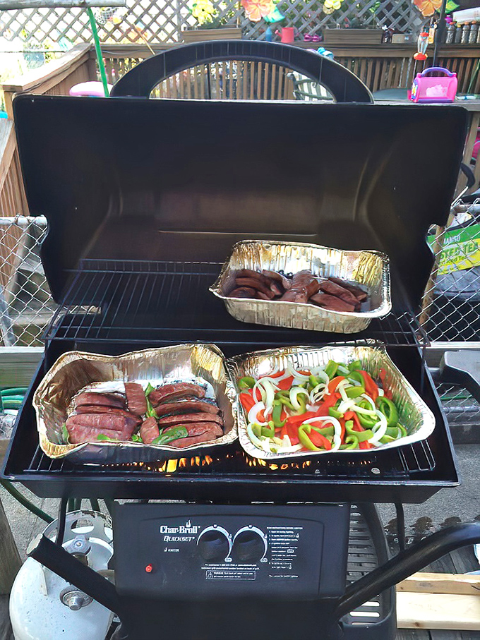 Kielbasa and peppers on the grill&mdash;proof that sometimes the simplest preparations yield the most profound flavors.