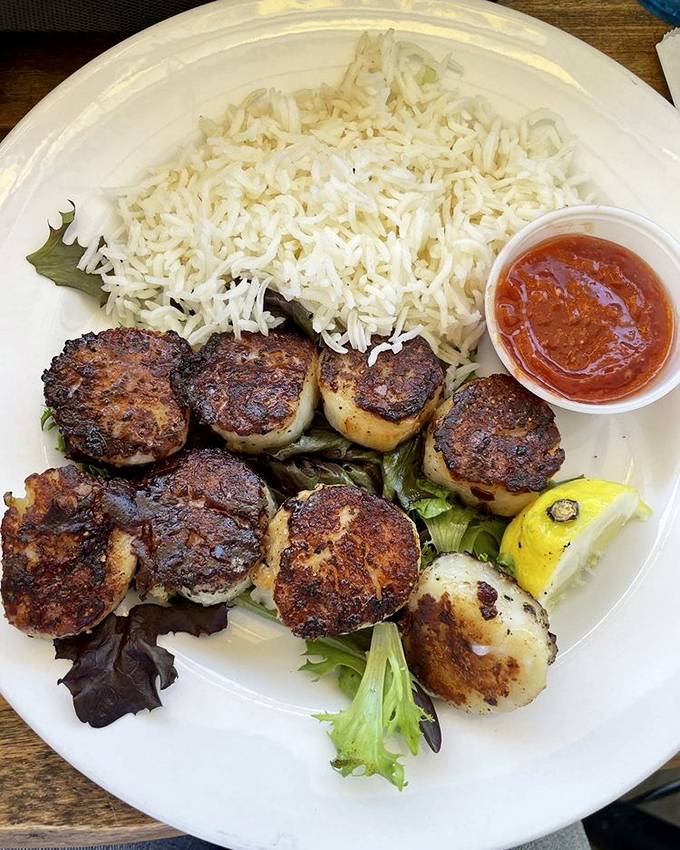 These perfectly seared scallops with their caramelized edges tell you everything you need to know about Big Water's commitment to seafood excellence.