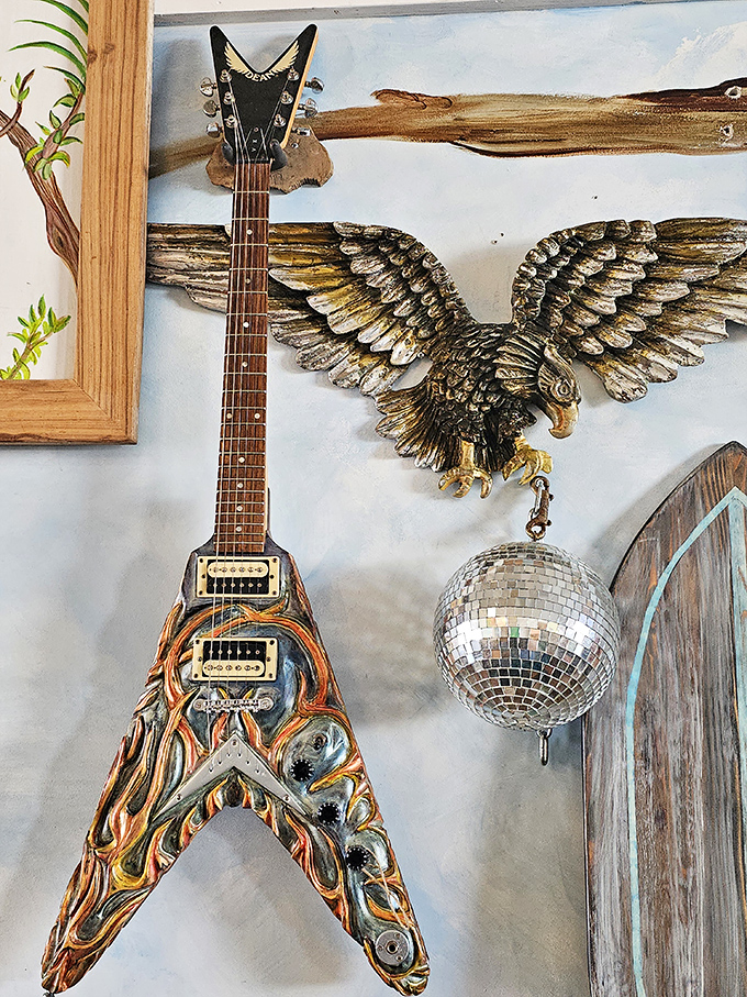 Rock and roll meets coastal cool in this guitar display, where musical instruments transform into wall art worthy of a Key West jam session.