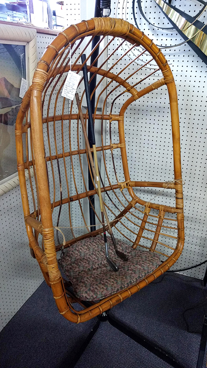 A hanging rattan chair that screams 1970s bohemian chic. This isn't just furniture&mdash;it's a time machine to an era when macram&eacute; was considered high art.