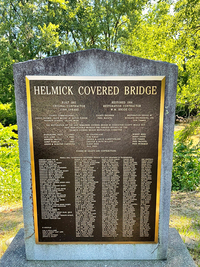 History cast in bronze. The marker reveals the bridge was built in 1867 and lovingly restored in 1996&mdash;a testament to community preservation.