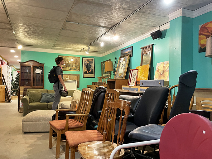 The furniture section's teal walls provide the perfect backdrop for an ever-changing collection of sofas, chairs, and tables seeking new homes.