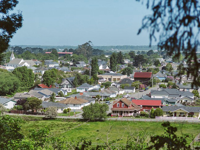 From this hillside vantage point, Ferndale spreads out like a miniature village &ndash; a patchwork of historic homes, church steeples, and everyday California life.