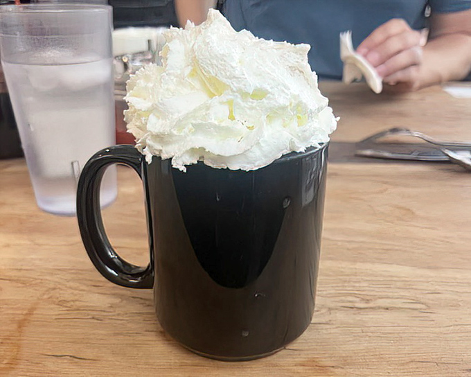 Hot chocolate that wears a cloud &ndash; this mug doesn't just warm your hands, it lifts your spirits with its whipped cream mountain.