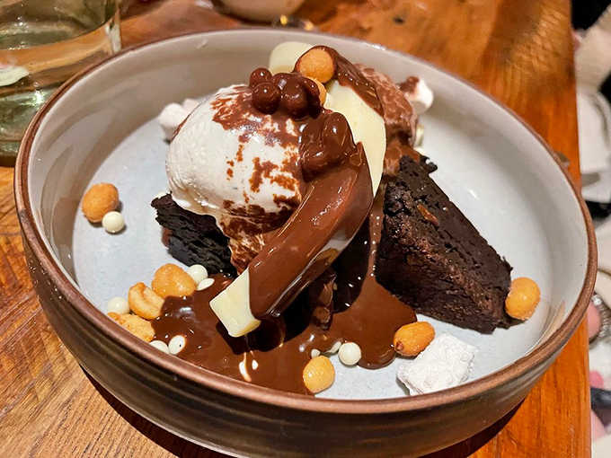 This chocolate dessert isn't just served&mdash;it's unleashed. Warm brownie, cool ice cream, and a chocolate sauce that flows like a dream. Resistance is futile. 