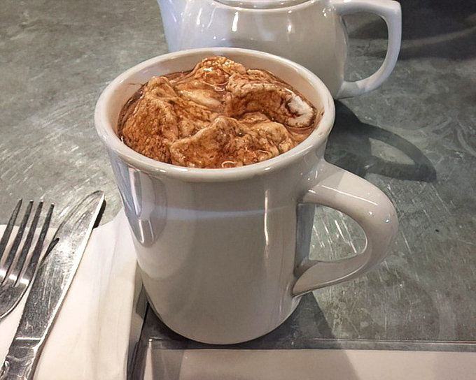 A mug of hot chocolate that demands to be cradled with both hands. The perfect companion to breakfast indulgence or a sweet finale to a savory feast.