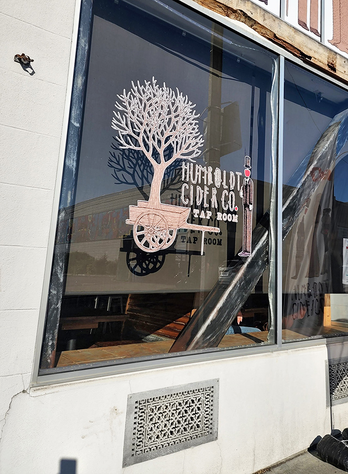 Humboldt Cider Company's artful window display hints at the craft beverage scene thriving in Eureka, where retirement means having time to savor local flavors.