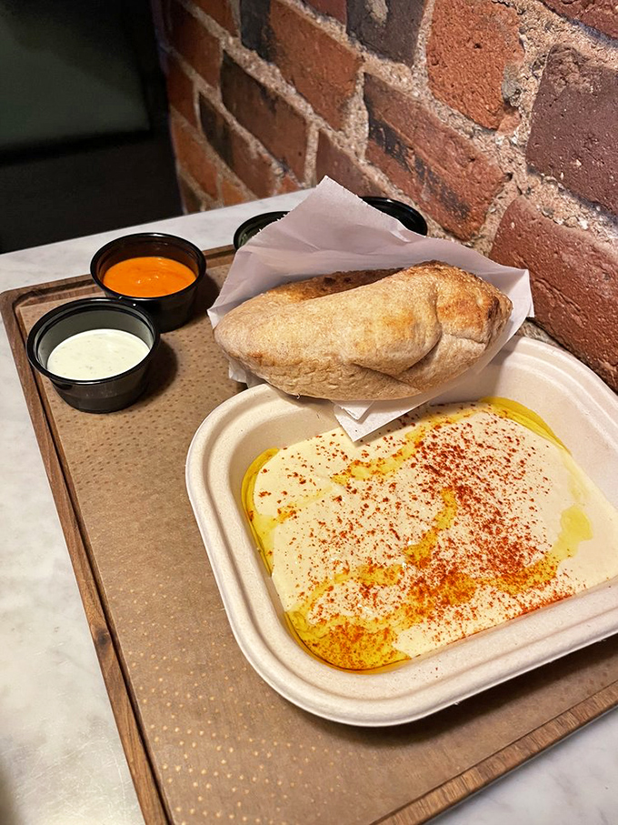 Hummus so silky it could moonlight as a cloud, drizzled with olive oil and dusted with spices&mdash;proof that simplicity, when done right, is the ultimate sophistication.