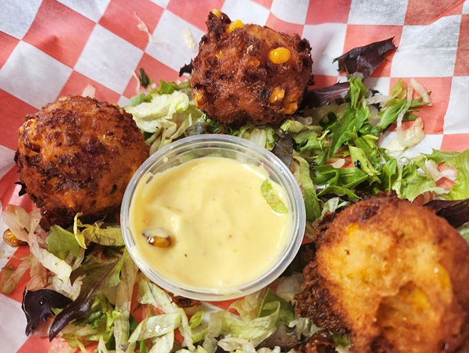 These hush puppies aren't telling secrets, but they're hiding pockets of corn and spices beneath that perfectly crisp exterior.