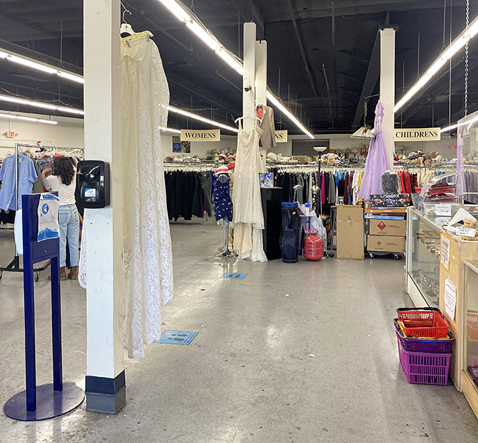 Wedding dresses standing like elegant ghosts, waiting for new brides. These once-worn gowns offer both savings and something borrowed in one beautiful package.