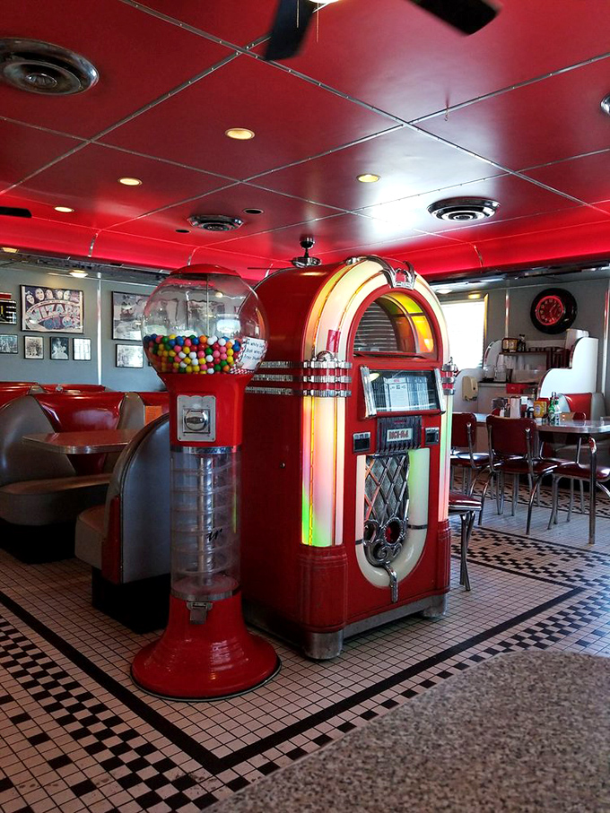 The jukebox stands guard like a colorful sentinel of nostalgia, ready to provide the soundtrack to your meal with the press of a button.
