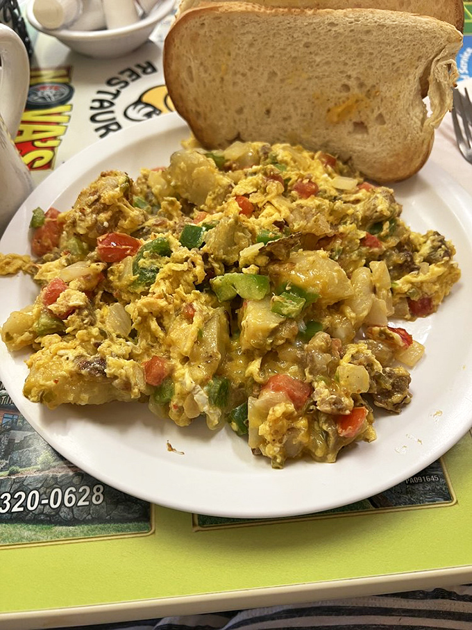This scramble isn't just eggs &ndash; it's a colorful morning convention where vegetables and cheese have gathered to start your day right.
