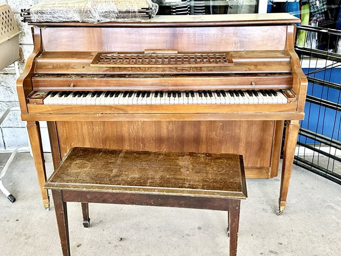 A piano with stories in every key. This Kimball upright is just waiting for someone to play "Heart and Soul" while shopping companions roll their eyes.