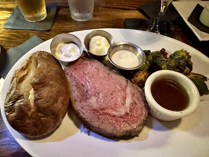 The prime rib presents itself in all its rosy, juicy glory&mdash;a testament to patience and proper cooking that makes you wonder why you'd ever order anything else on Sunday nights.
