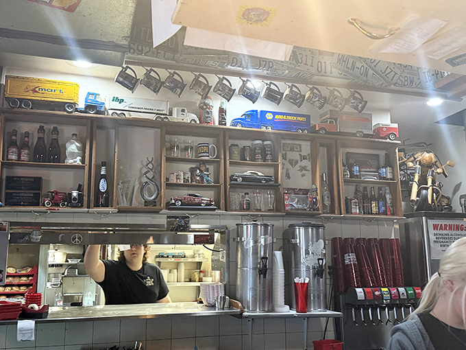 Behind every great BBQ joint is a kitchen window where magic happens. Those vintage collectibles on the shelves tell you this place values history as much as flavor.