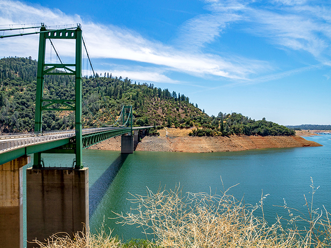 The green bridge spanning Lake Oroville connects more than just shorelines. This engineering marvel provides spectacular views of the reservoir that powers much of Northern California.