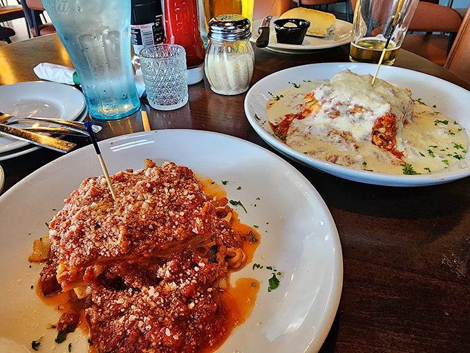 A tale of two pastas&mdash;one robust with marinara courage, the other creamy with alfredo comfort. This isn't just dinner; it's a choose-your-own-adventure in Italian form.