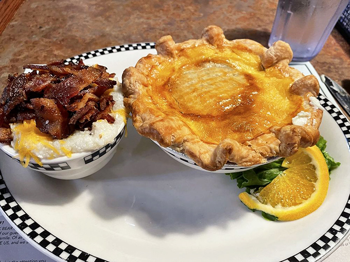 Comfort food paradise on a plate—where grits meet cheese and pot pie crust reaches for the heavens like a flaky golden dome.