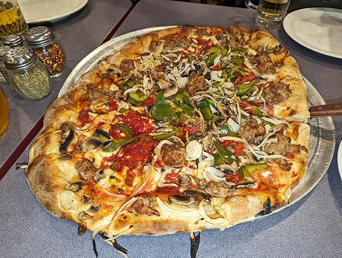 The "Works" in all its glory&mdash;a pizza so loaded it requires structural engineering and an appetite of equal ambition.