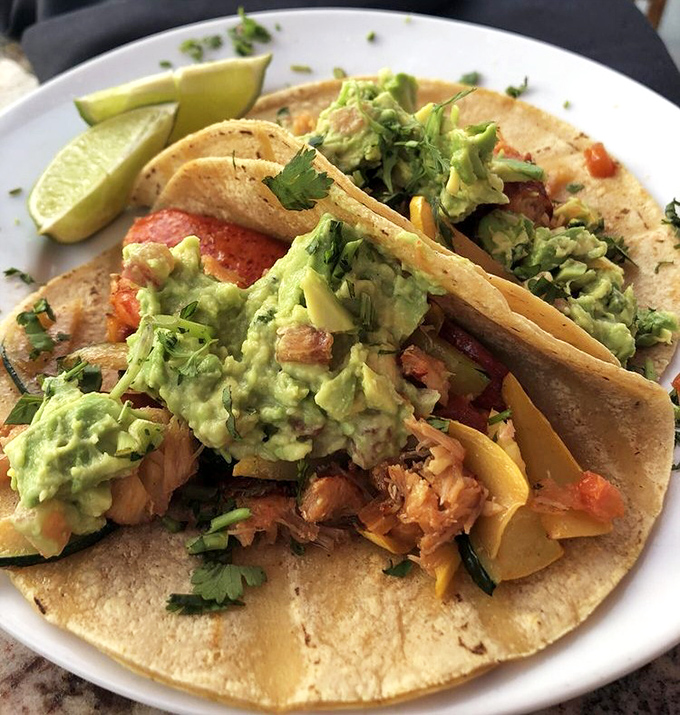 Lobster tacos topped with generous avocado&mdash;California's way of saying "we take our taco responsibility very seriously around here."